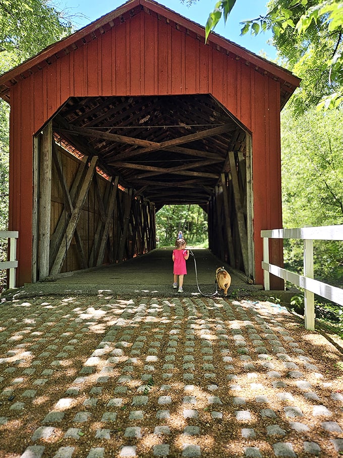 A moment of pure Americana: a child and faithful companion explore the bridge together, creating memories that will outlast even this historic structure.