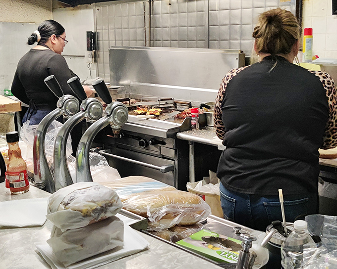 Behind the scenes, the magic happens on a well-seasoned flat-top grill. Decades of flavor have seasoned this cooking surface better than any chef could.