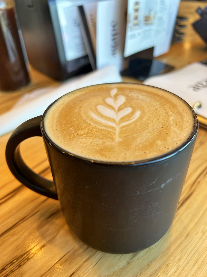 Latte art so pretty you almost don't want to drink it. Almost. That leaf design is basically saying, "Instagram me before the first sip."