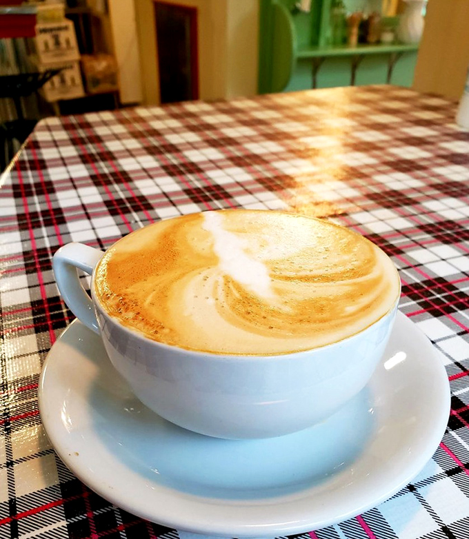 Latte art blooms in your cup while red plaid tablecloths set the scene for perfect pie pairings.