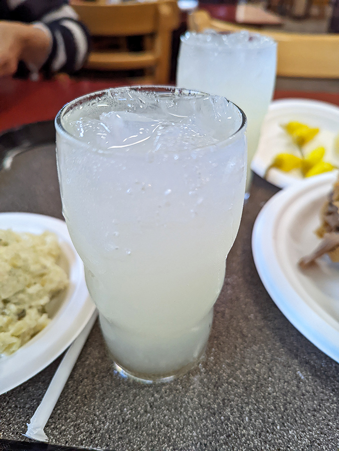 Their lemonade – a glass of sunshine that cuts through the richness of the sandwiches like a well-timed punchline.