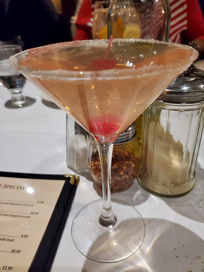 This isn't just a martini&mdash;it's liquid elegance with a cherry surprise waiting at the bottom, promising momentary escape from decision-making responsibilities.