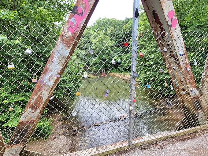 Love locks adorn the fence overlooking the creek, a modern tradition of romance in a place otherwise known for its ghostly tales.