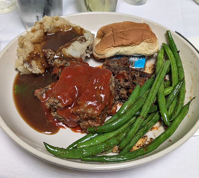 Meatloaf that would make your grandmother both proud and jealous, swimming in gravy deep enough to need a lifeguard.