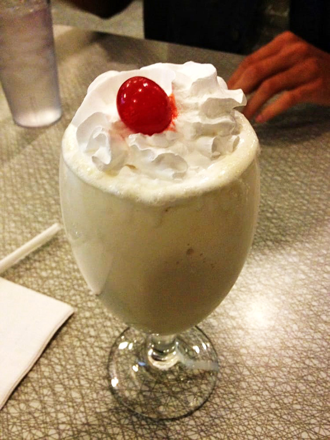 This isn't just a milkshake—it's dessert with a straw, topped with enough whipped cream to make your inner child do backflips.