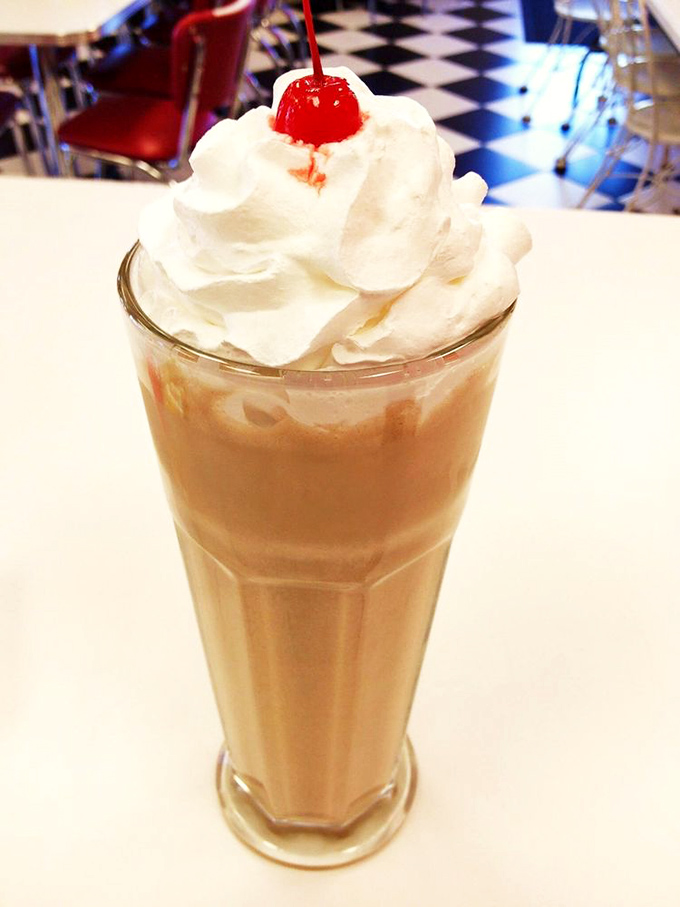 The legendary milkshake arrives topped with whipped cream and a cherry, silently asking, "Did you really think you could finish me alone?"