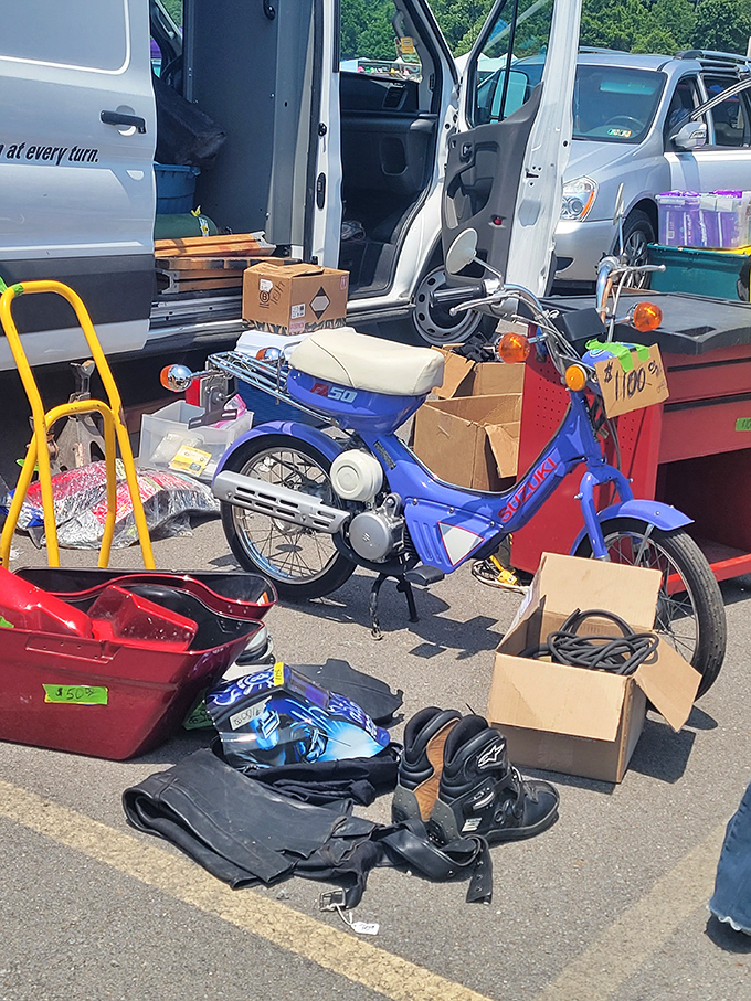 That blue Suzuki moped isn't just transportation; it's a time machine to carefree teenage summers when gas cost pennies and helmets were optional.