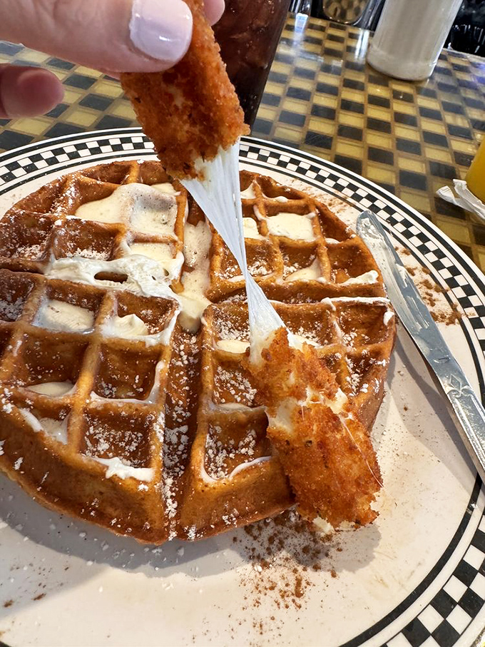 Waffle architecture at its finest! Crisp exterior, fluffy interior, and that pull of melted butter &ndash; breakfast engineering that deserves a standing ovation.