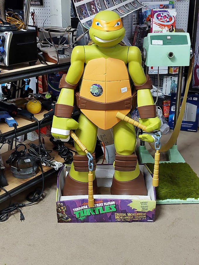 Cowabunga! A life-sized Michelangelo stands guard over vintage toys. He's seen better days fighting Shredder, but he's ready for a second life in your game room.
