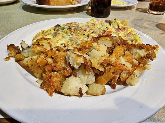 The perfect diner breakfast doesn't exi&mdash; Oh wait, here it is: a loaded omelet with home fries crisped to golden perfection.