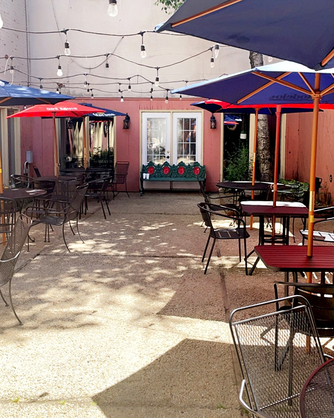 Outdoor dining where string lights transform ordinary evenings into memory-making moments. This patio isn't just eating space&mdash;it's where summer finds its purpose.