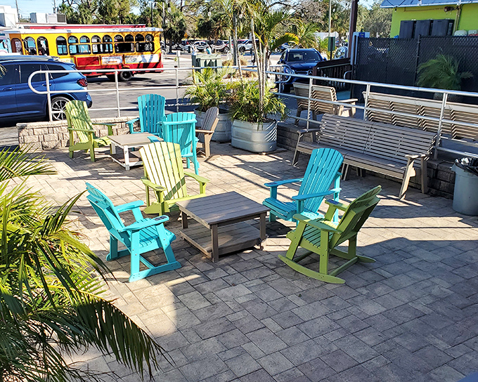 Colorful Adirondack chairs create a laid-back lounge area where waiting for a table becomes part of the pleasure, not the pain.