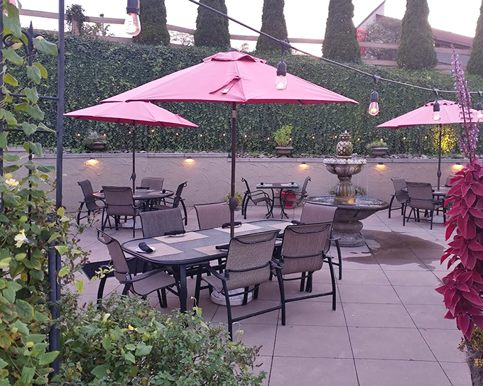 The outdoor patio&mdash;where summer evenings, pink umbrellas, and post-dinner conversations create memories that outlast the meal itself.