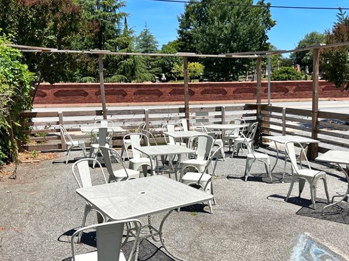 The outdoor seating area offers a sun-dappled escape from Atlanta's hustle, where breakfast conversations stretch lazily into lunch.