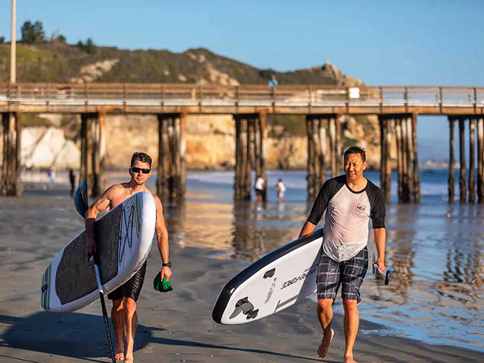 Paddleboarders return from communing with the Pacific, their smiles as wide as the horizon. Some therapy sessions don't require talking.