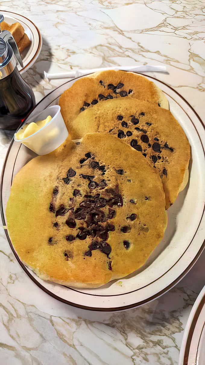 Chocolate chip pancakes that make you question why anyone would ever settle for the frozen kind. Butter melting like a summer romance.