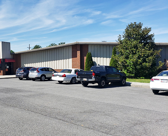 The parking lot fills early with treasure hunters from counties away. License plates tell the story of how far people will drive for a chance at nostalgia.