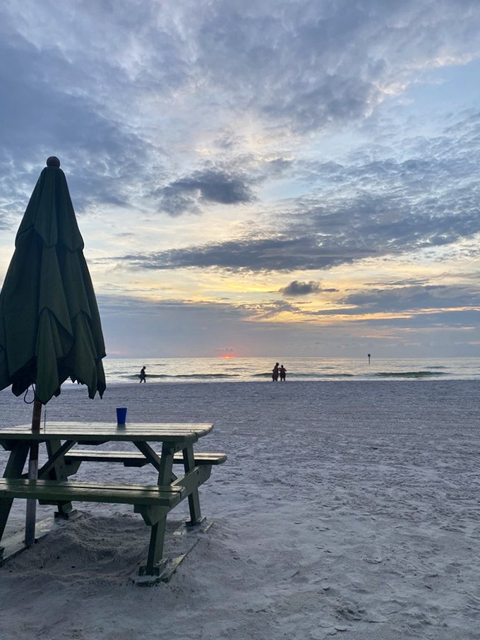 Sunset picnic tables—where sandy feet are welcome and dinner with a Gulf view makes even peanut butter sandwiches taste gourmet.