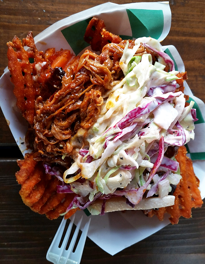 Pulled pork and crispy fries having the most delicious reunion imaginable. The coleslaw adds just the right fresh crunch.