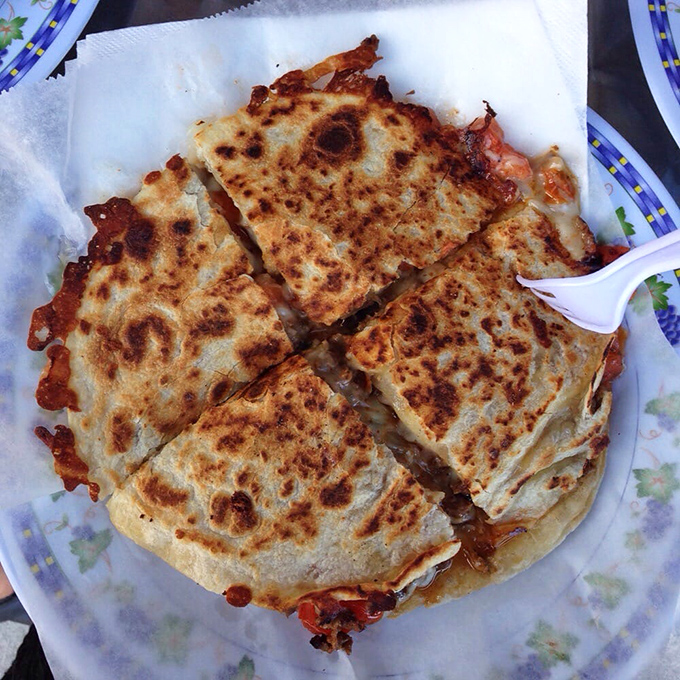 Golden-brown quesadilla quarters with cheese pulling like the strings of a delicious marionette. Resistance is futile.