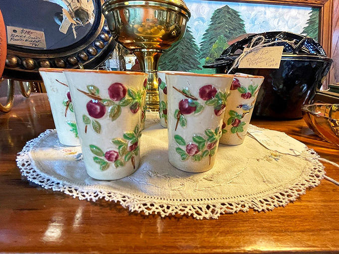 Delicate cherry blossom cups resting on handmade lace &ndash; proof that sometimes the smallest treasures carry the most charm and evoke the strongest memories.