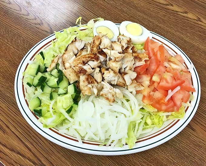 A colorful salad plate demonstrates the fresh side of diner fare&mdash;proof that sometimes vegetables can hold their own alongside sandwich royalty.