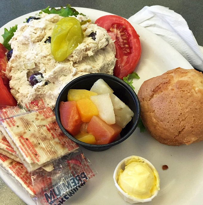 A chicken salad plate that proves healthy-ish options don't have to be punishment. That muffin isn't just a side&mdash;it's dessert in disguise. 