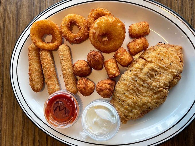 The indecisive diner's dream plate: onion rings, mozzarella sticks, and chicken&mdash;a fried trifecta that says "diet starts tomorrow" in the most delicious way. 