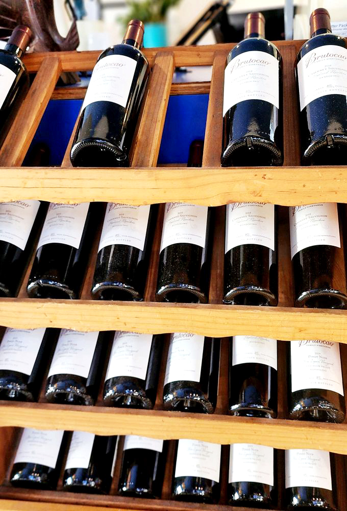 Wine racks filled with bottles that have been carefully selected to complement the ocean's bounty. Each one waiting for its perfect seafood pairing.