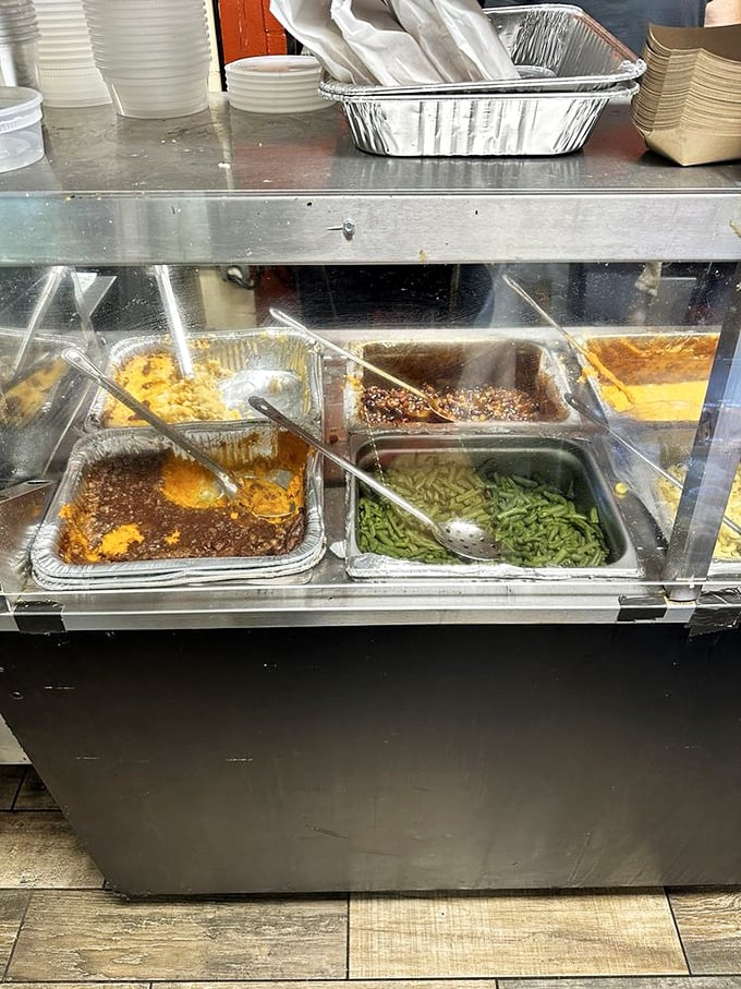 The side dish station&mdash;where vegetables earn their place at the barbecue table. Green beans, mac and cheese, and corn pudding wait patiently for their supporting roles.