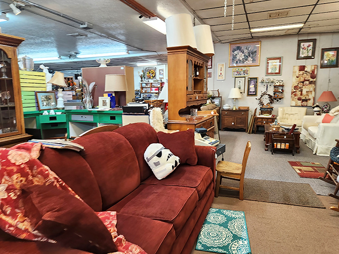Cozy seating arrangements await new homes. That burgundy sofa has seen things&mdash;including a Stormtrooper mask ready for its next mission.