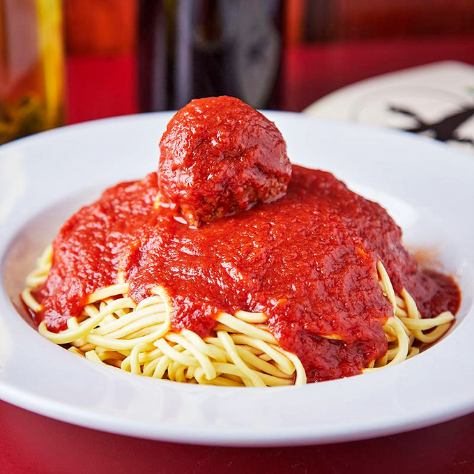 The holy trinity of Italian-American cuisine: perfectly cooked spaghetti, vibrant red sauce, and meatballs that would make any nonna proud.