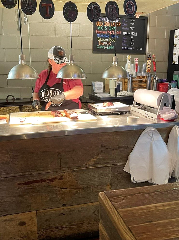 Behind every great barbecue is someone with skilled hands and patience. Here's where the magic happens, one perfectly sliced piece of meat at a time.