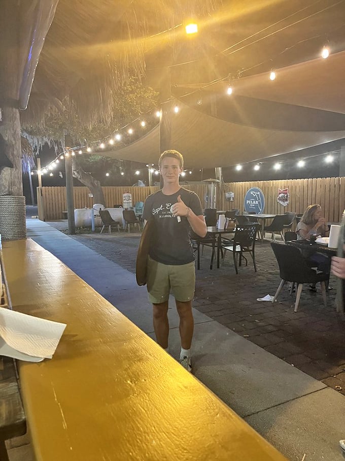 The outdoor patio at Captain Eddie's offers string lights, cool breezes, and the kind of relaxed Florida vibe that makes you want to stay forever.