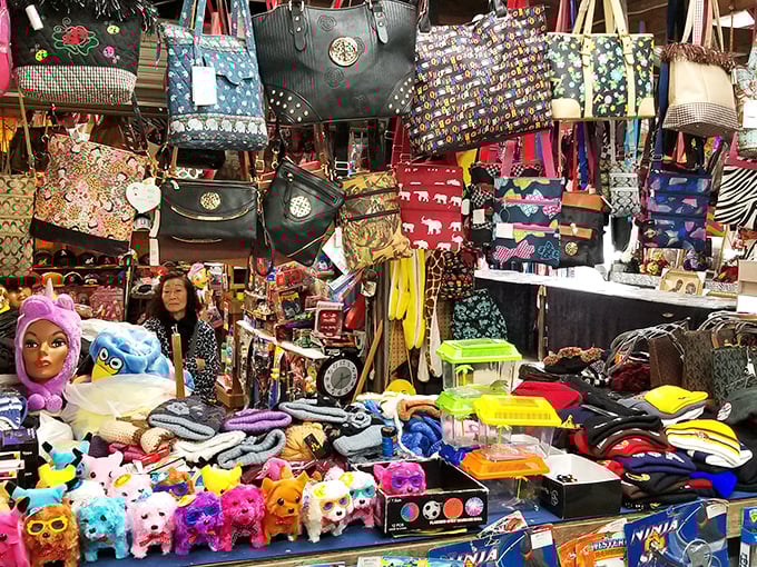 A kaleidoscope of colorful bags and plush toys creates a carnival of commerce where shoppers can find both necessities and whimsies.