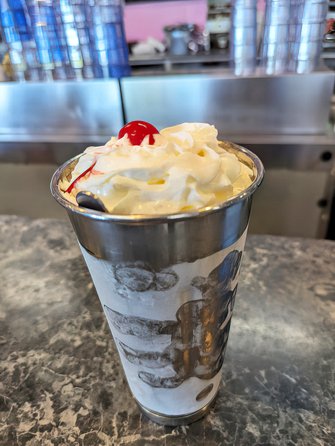 Not just a milkshake&mdash;a tower of vanilla dreams topped with whipped cream and a cherry that's basically wearing a crown.