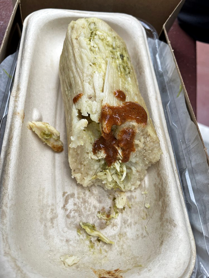 Tamale treasure unwrapped. This corn husk-steamed delight proves that some of life's greatest pleasures come in humble packages.