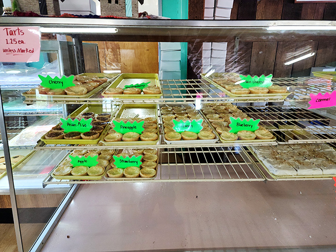 A display case of tarts that would make Martha Stewart do a double-take. Each one is like a miniature edible work of art.