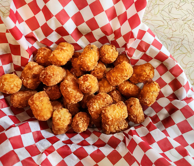 Golden-brown tater tots nestled in their checkered paper cradle&mdash;each one a crispy, potato-y time machine back to the best school lunch you never had.