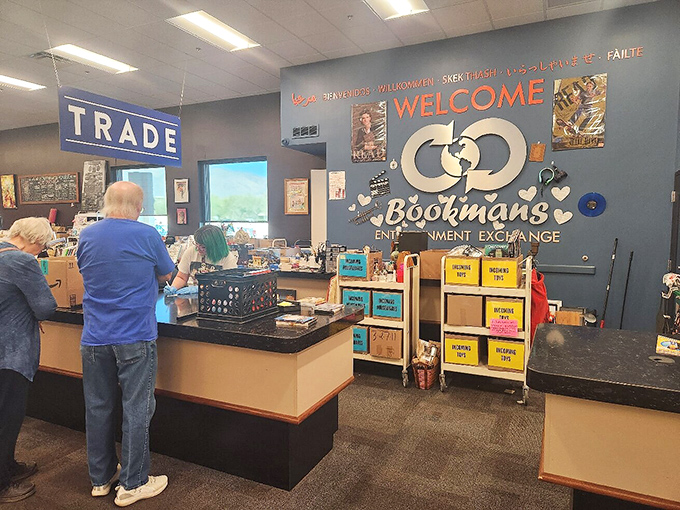 The "TRADE" sign marks the spot where cultural alchemy happens, transforming your finished adventures into credit for new ones.