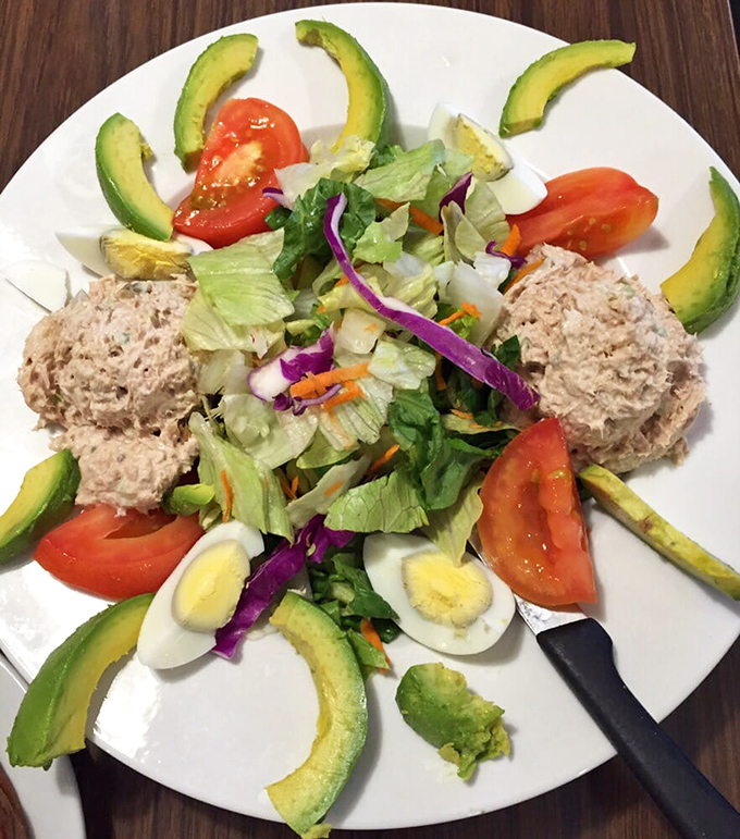 Who knew a salad could look this inviting? Fresh avocado, vibrant tomatoes, and perfectly prepared tuna create a lighter option that doesn't sacrifice satisfaction.