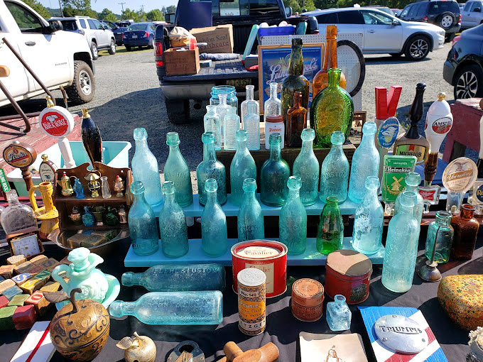 Aqua glass bottles catching the sunlight like jewels &ndash; each one carrying stories of sodas, medicines, and spirits from generations past.