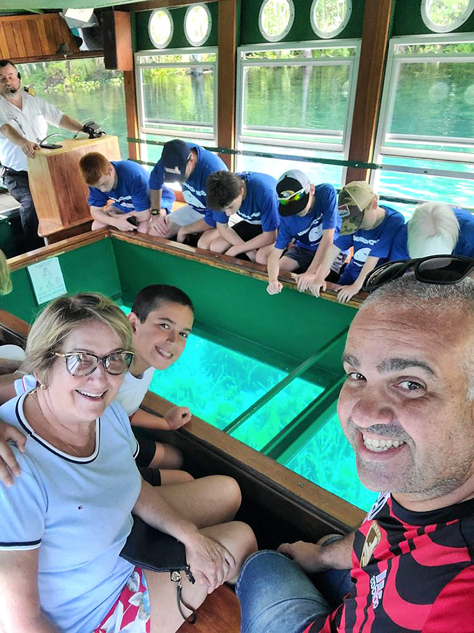 Inside the glass-bottom boat, where "Look down!" replaces "Look up!" and underwater wonders replace ceiling frescoes. 