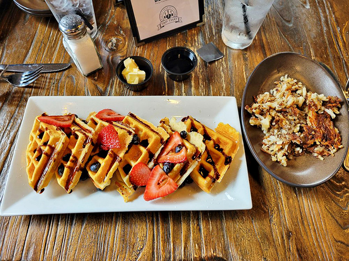 Breakfast or dessert? Who cares when waffles come adorned with fresh strawberries like edible jewelry on a plate.