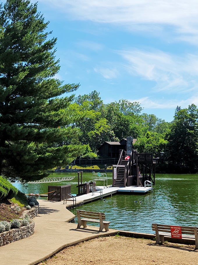 Summer serenity at Berne's waterfront where a simple dock invites lazy afternoon swims. Who needs expensive water parks when nature provides the perfect cooling spot?