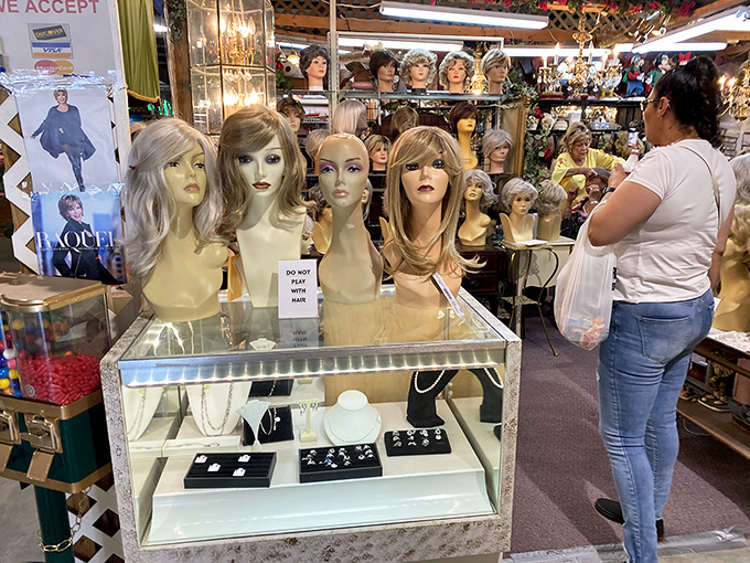 The wig display that makes you wonder about second acts and fresh starts. Each mannequin seems to whisper, "Go ahead, try something new."