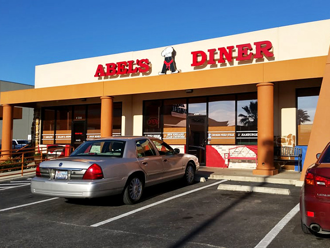 Abel's Diner's cheerful facade welcomes hungry travelers. Those bright red letters promise comfort food that'll make you forget your troubles.