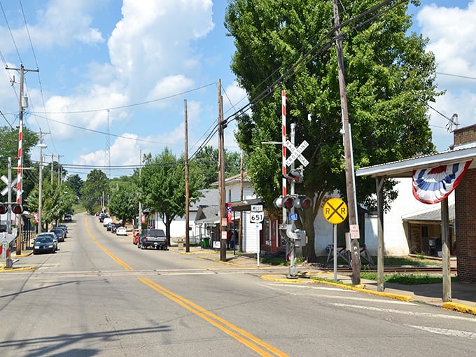 Main Street crossing. Where the biggest traffic concern is whether to visit the bakery or the cheese shop first.