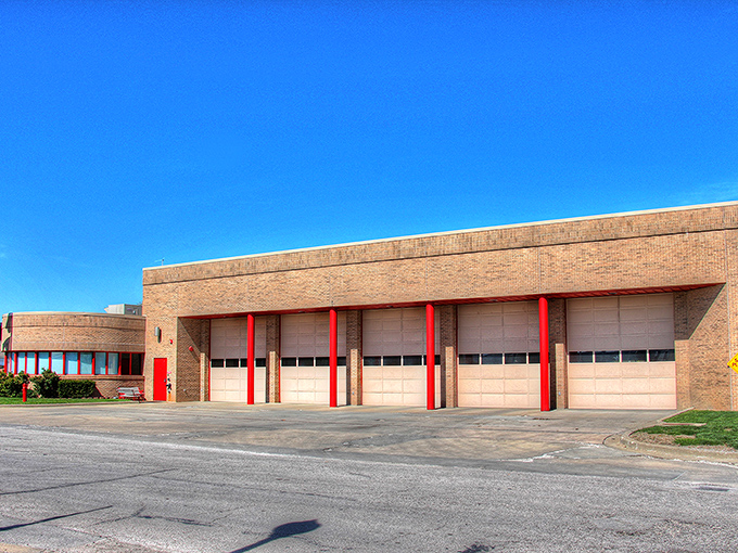 Red brick fire station stands ready like a dependable neighbor you can count on.
