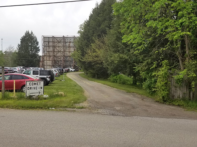 The entrance to Comet Drive-In beckons from the roadside, promising celluloid dreams just down that gravel path.